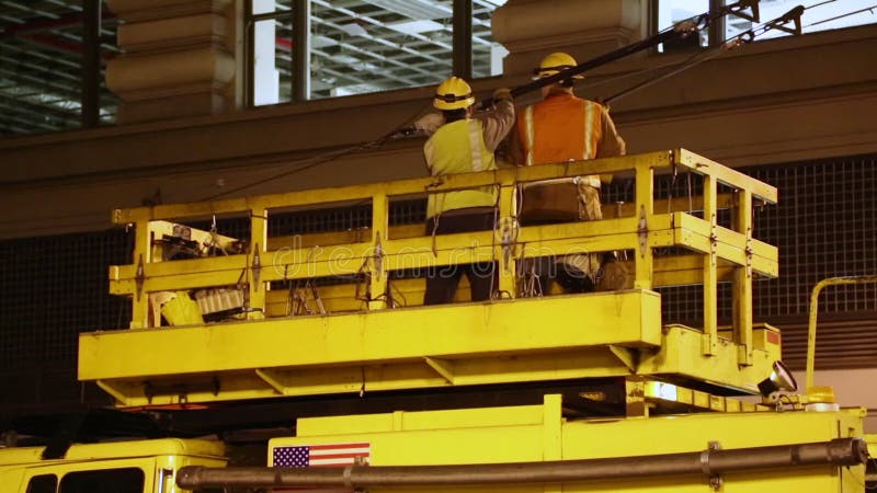 Electrical Workers on Telehandler with Bucket Installing High Tension ...