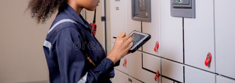 Electrical Young Asian Woman and Man Engineer Examining Maintenance Cabinet System Electric in ...