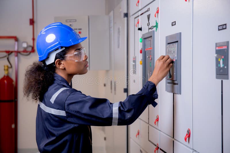 Electrical Young Asian Woman Engineer Examining Maintenance Cabinet ... Electrical Young Asian Woman Engineer Examining Maintenance Cabinet ...