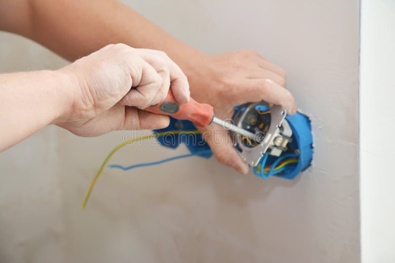 Electrican Installing Socket, Outlet Plug in New House Wall Stock Photo ...