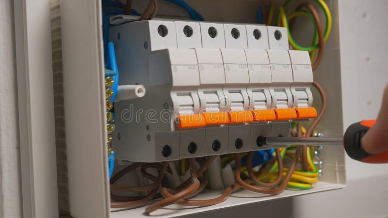 Electrician Assembles Electrical Panel. Close Up of a Man Hands ...