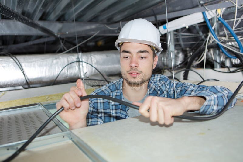 Electrician checking cable stock image. Image of power - 292366719