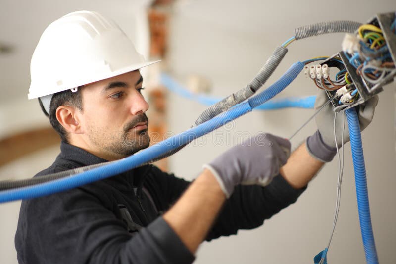 Electrician Checking Electrical Installation in a House Under ...