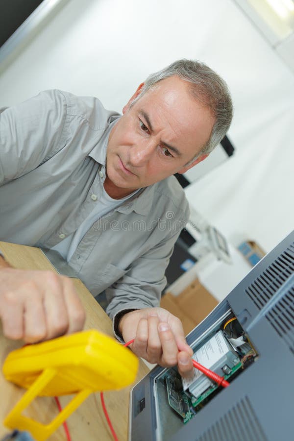 Electrician Checking Fuse Box with Multimeter Stock Photo - Image of ...