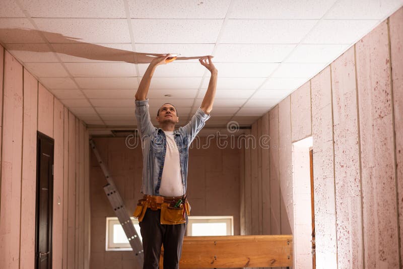 Electrician Checking Lighting To the Ceiling in the Home, Technician ...