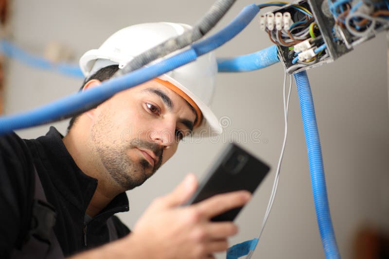 Electrician Checking Phone Installing Electrical System Stock Image ...