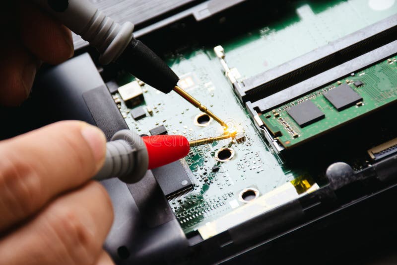 Electrician Checks Electronic Circuit Board by Probe of Digital ...