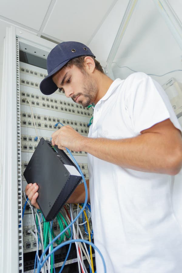 Electrician Connect Internet Server To Power Board Stock Image - Image ...