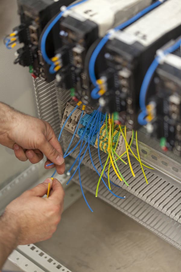 Electrician Connecting Wire on the Control Panel Stock Photo - Image of ...