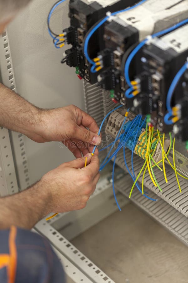 Electrician Connecting Wire on the Control Panel Stock Photo - Image of ...