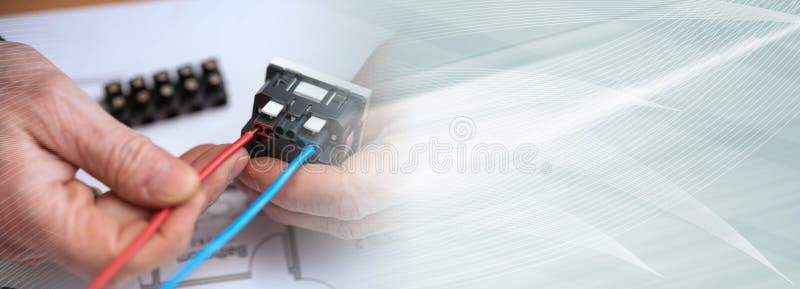 Electrician Connecting a Wire into a Power Socket; Panoramic Banner ...