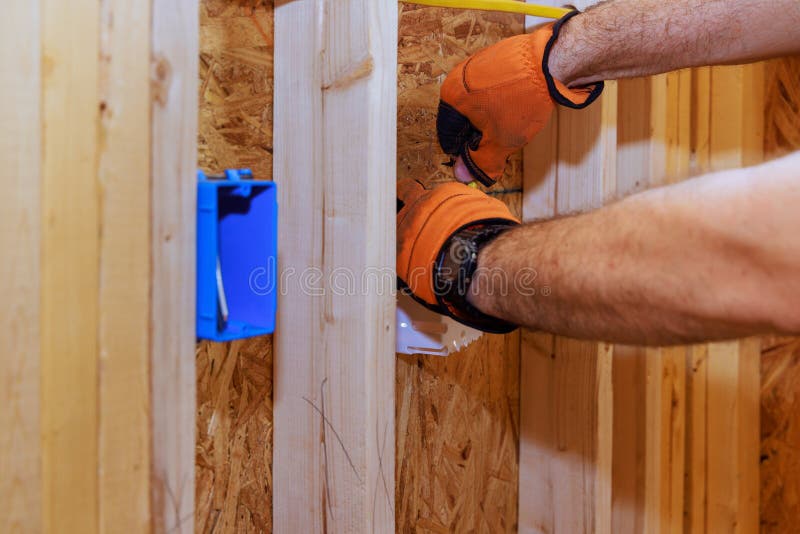 An Electrician Connects Wires To Socket Box in a New Building during ...
