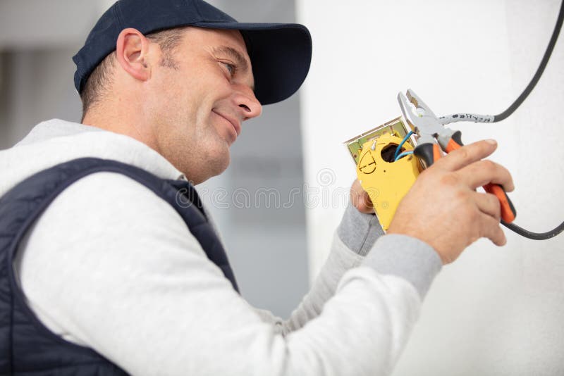 Electrician Cuts Cable at Junction-box Stock Image - Image of ...