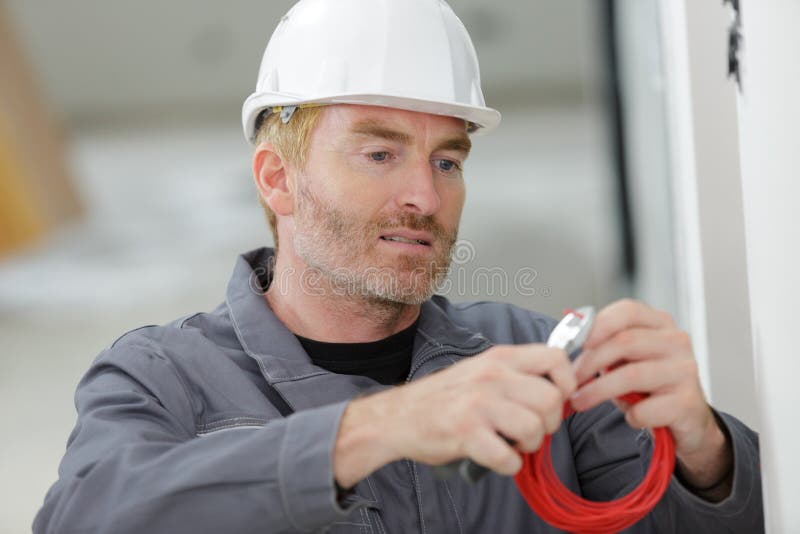 Electrician Cutting Red Wire with Cable Cutters Stock Image - Image of ...