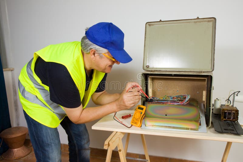 Electrician and device stock image. Image of labor, electric - 28247823