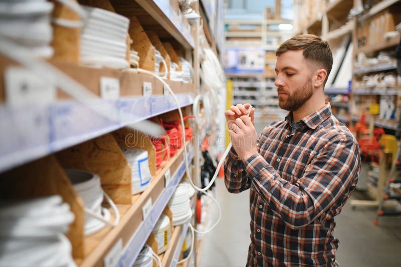 Electrician in the Electrical Component Store. Construction Industry ...
