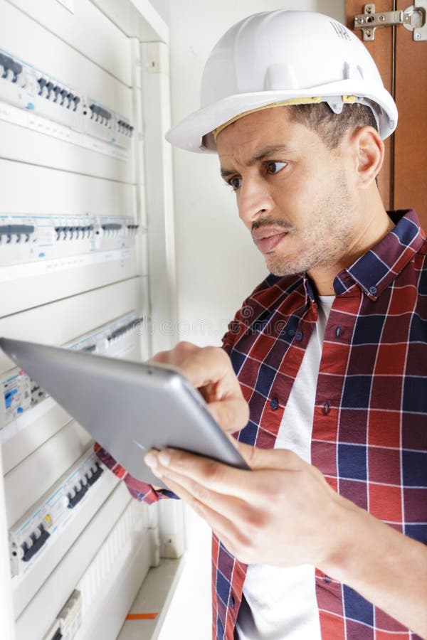 Electrician Engineer Holding Tablet Computer Stock Image - Image of ...