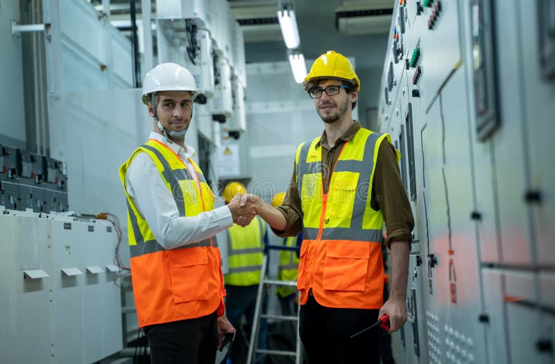 Electrician shaking hands stock image. Image of hardhat - 35514327