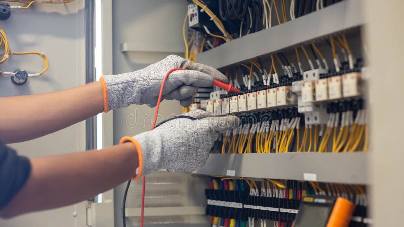 Electrician Engineer Uses a Multimeter To Test the Electrical ...