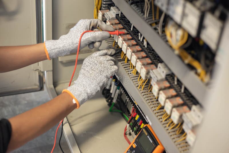 Electrician Engineer Uses a Multimeter To Test the Electrical ...