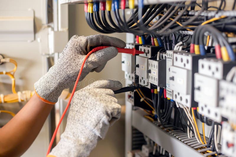 Electrician Engineer Uses a Multimeter To Test the Electrical ...