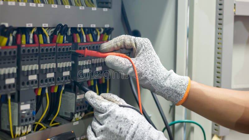 Electrician Engineer Uses a Multimeter To Test the Electrical ...