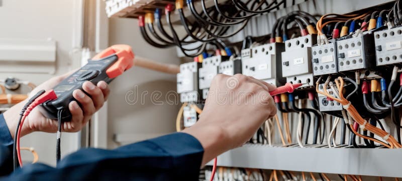 Electrician Engineer Uses a Multimeter To Test the Electrical ...