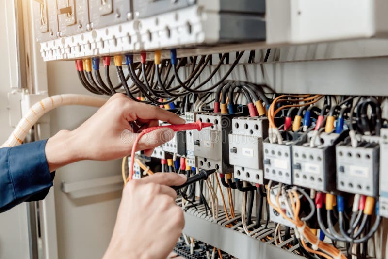 Electrician Engineer Uses a Multimeter To Test the Electrical ...