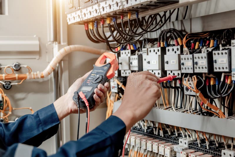 Electrician Engineer Uses a Multimeter To Test the Electrical ...