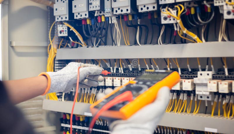 Electrician Engineer Uses a Multimeter To Test the Electrical ...