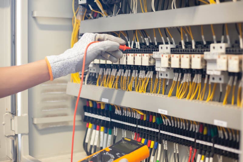 Electrician Engineer Uses a Multimeter To Test the Electrical ...