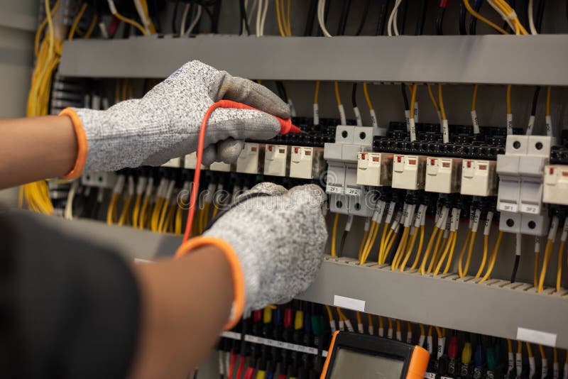 Electrician Engineer Uses a Multimeter To Test the Electrical ...