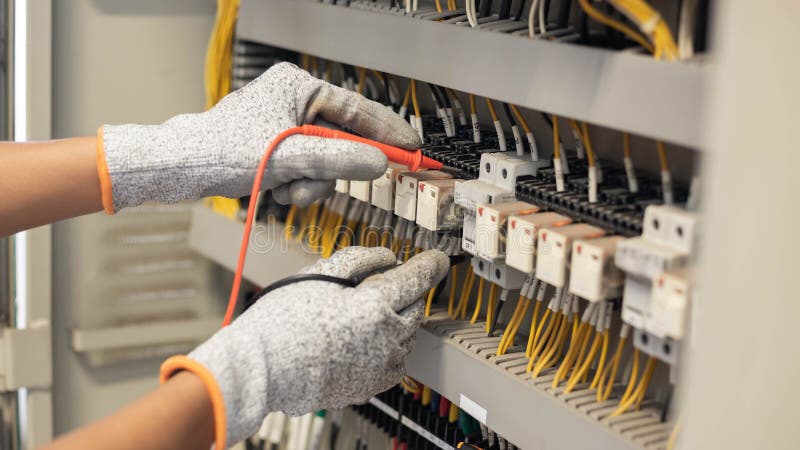 Electrician Engineer Uses a Multimeter To Test the Electrical ...