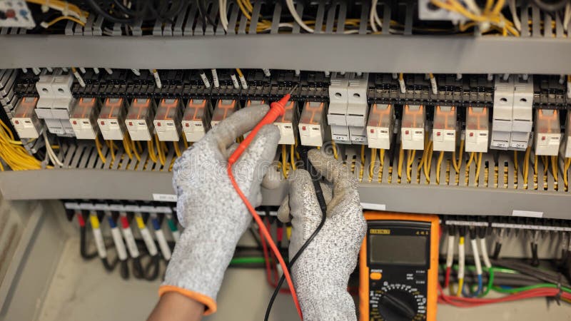 Electrician Engineer Uses a Multimeter To Test the Electrical ...
