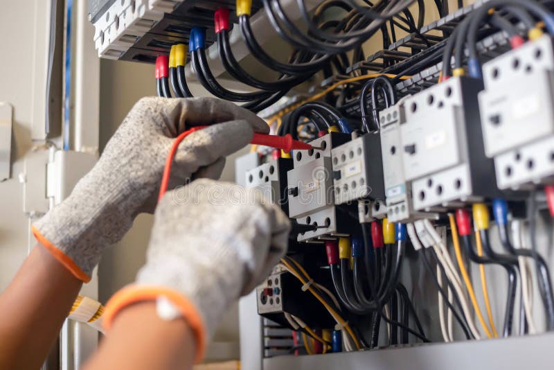 Electrician Engineer Uses a Multimeter To Test the Electrical ...