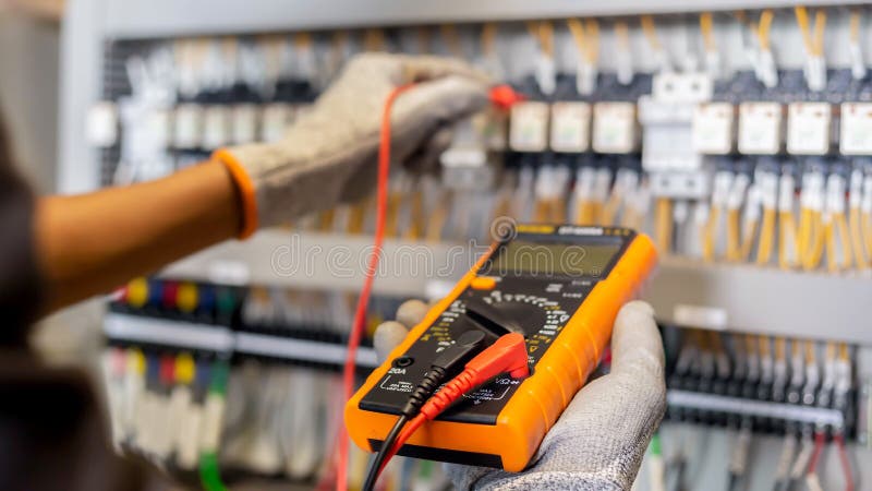 Electrician Engineer Uses a Multimeter To Test the Electrical ...