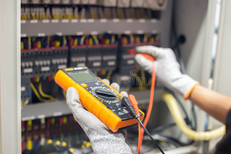 Electrician Engineer Uses a Multimeter To Test the Electrical ...