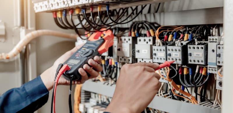 Electrician Engineer Uses a Multimeter To Test the Electrical ...