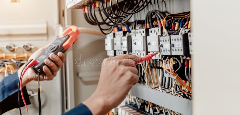 Electrician Engineer Uses a Multimeter To Test the Electrical ...