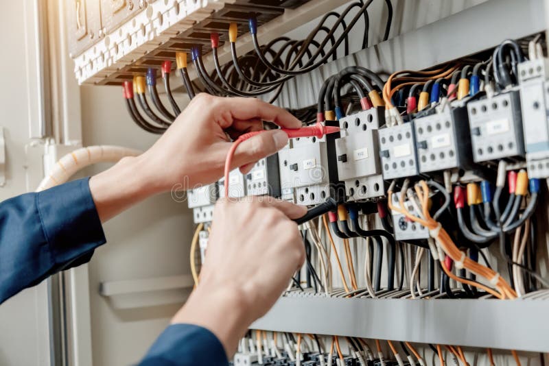 Electrician Engineer Uses a Multimeter To Test the Electrical ...