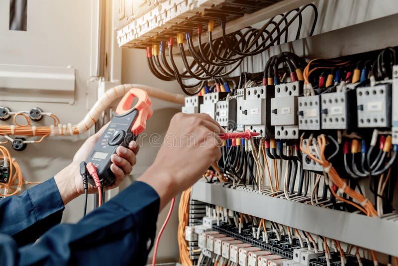 Electrician Engineer Uses a Multimeter To Test the Electrical ...