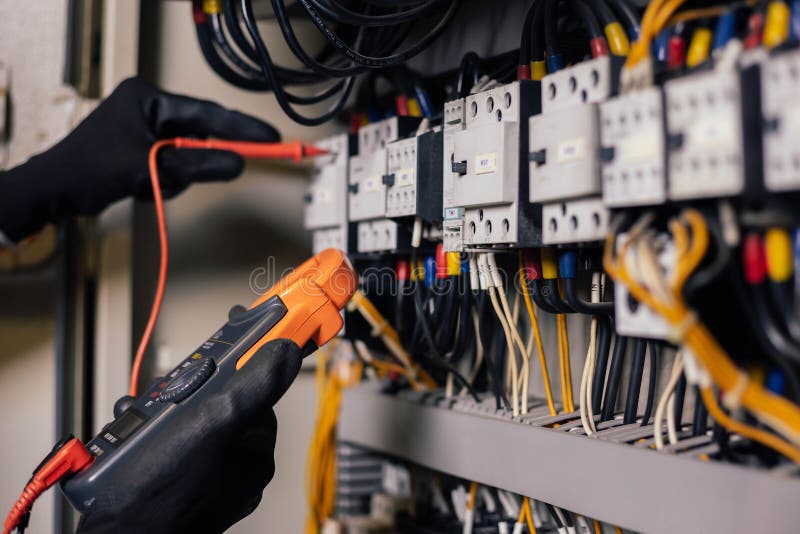 Electrician Engineer Work Tester Measuring Voltage and Current of Power ...