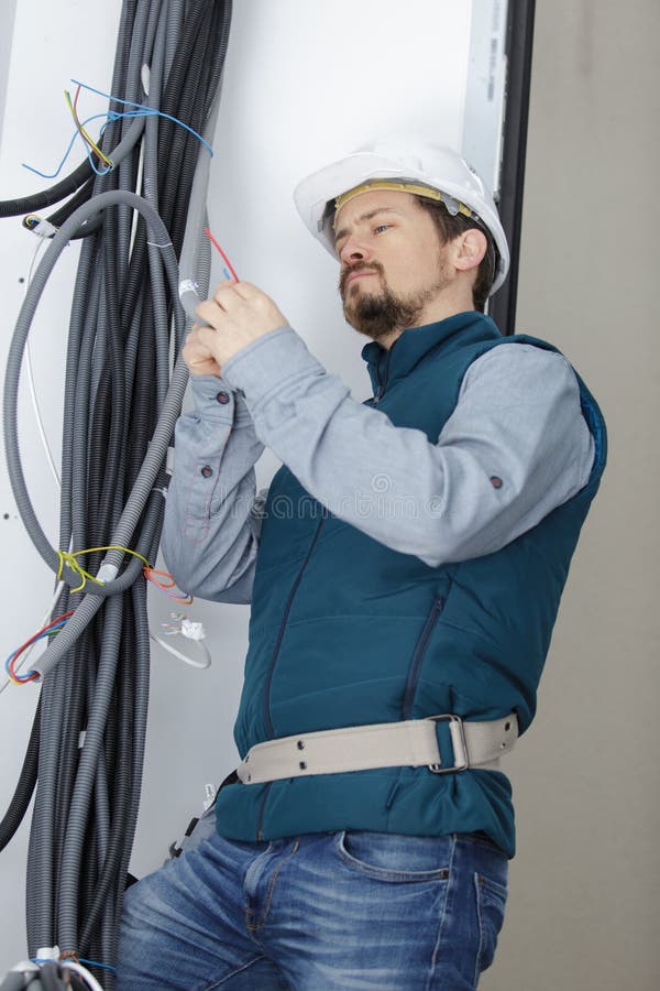 Electrician Engineer Works with Electric Cable on Fuse Switch Box Stock ...