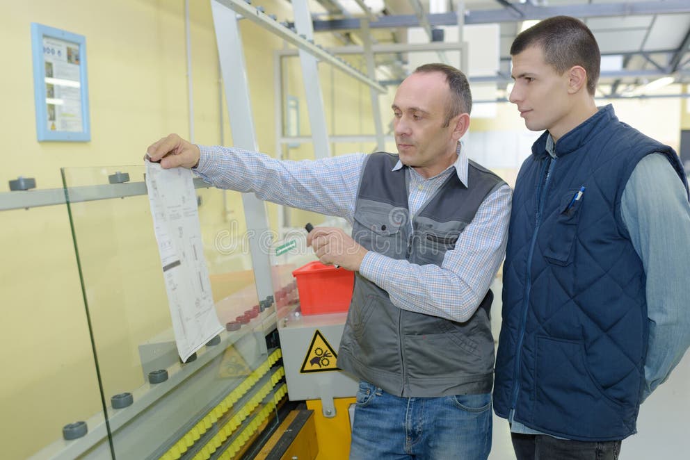 Electrician Explaining Trainee Building Electric Plan Stock Image ...