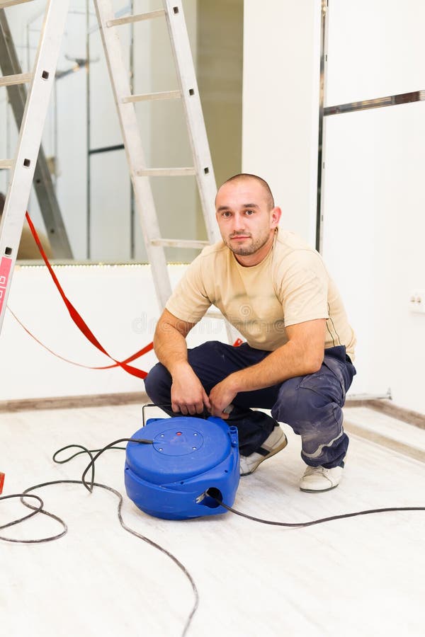 Electrician with Extension Cable Stock Photo - Image of installation ...