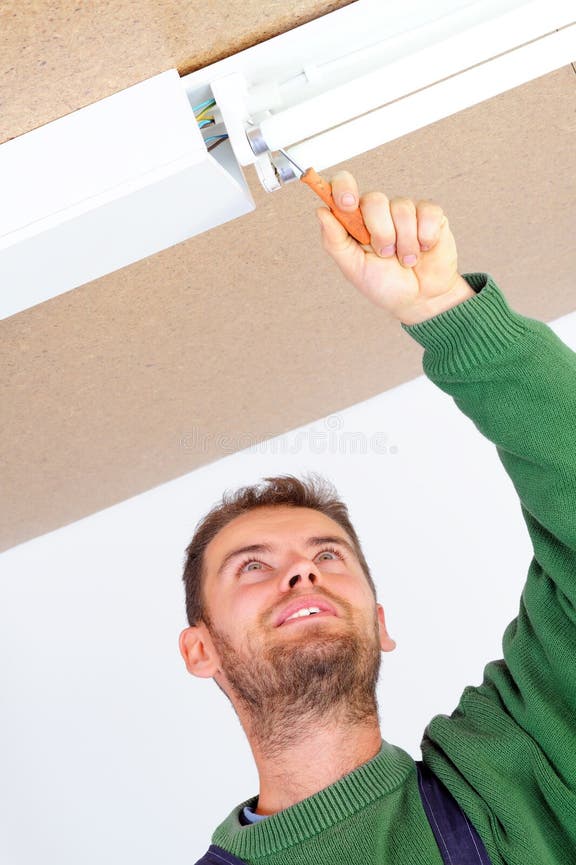 Electrician Fixing Ceiling Light Stock Photo - Image of electrician ...