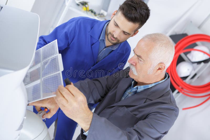 Electrician Fixing Electrical Devices with Different Tools Stock Photo ...