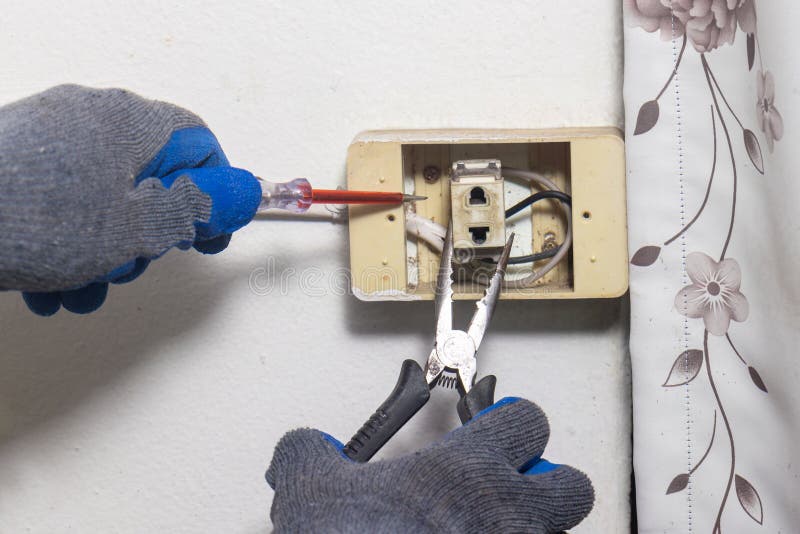 Electrician is Fixing Old Sockets of a Residential Stock Photo - Image ...