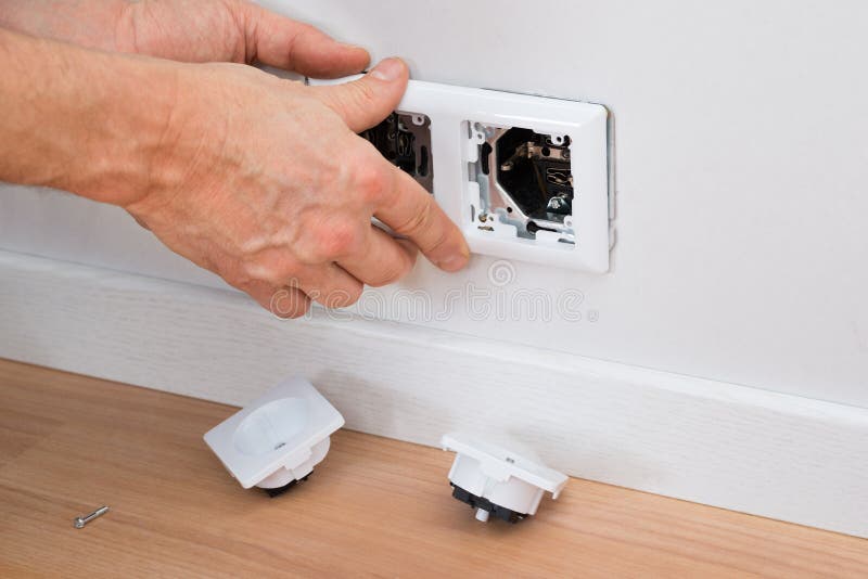 Electrician fixing socket stock image. Image of fixing - 54961911