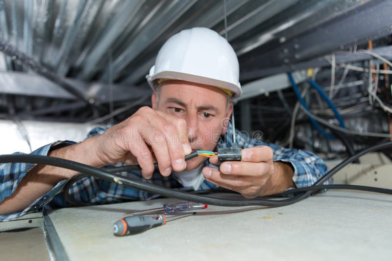 Electrician Fixing Up Wiring Stock Image - Image of services ...